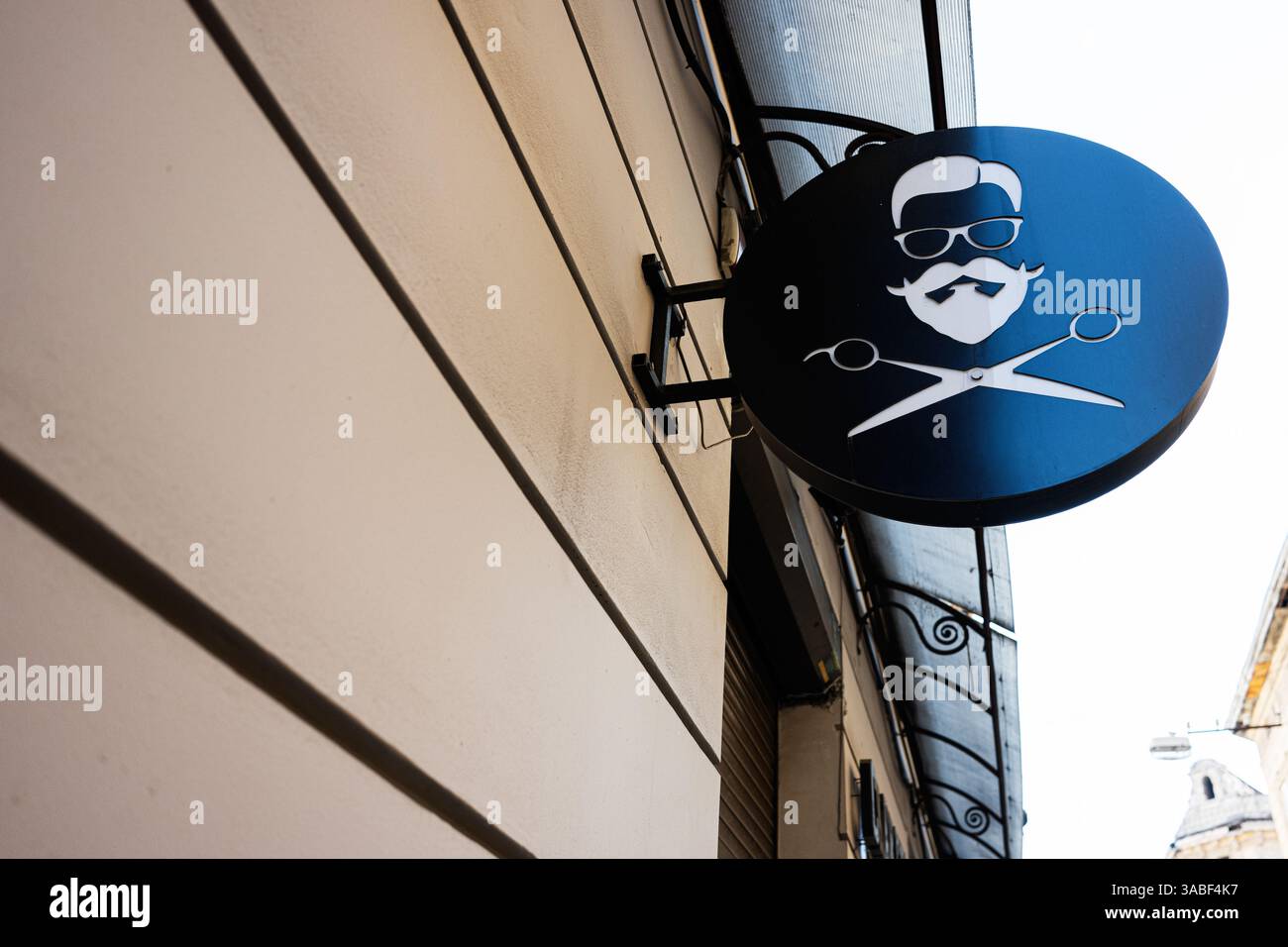 Lviv, Ukraine - April 01, 2025: A stylish barber shop sign with a retro ...