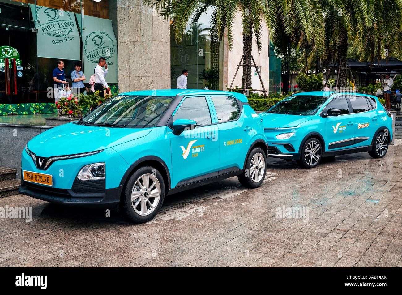 Blue Vietnamese electric cars Vinfast taxi on the street in Vietnam ...