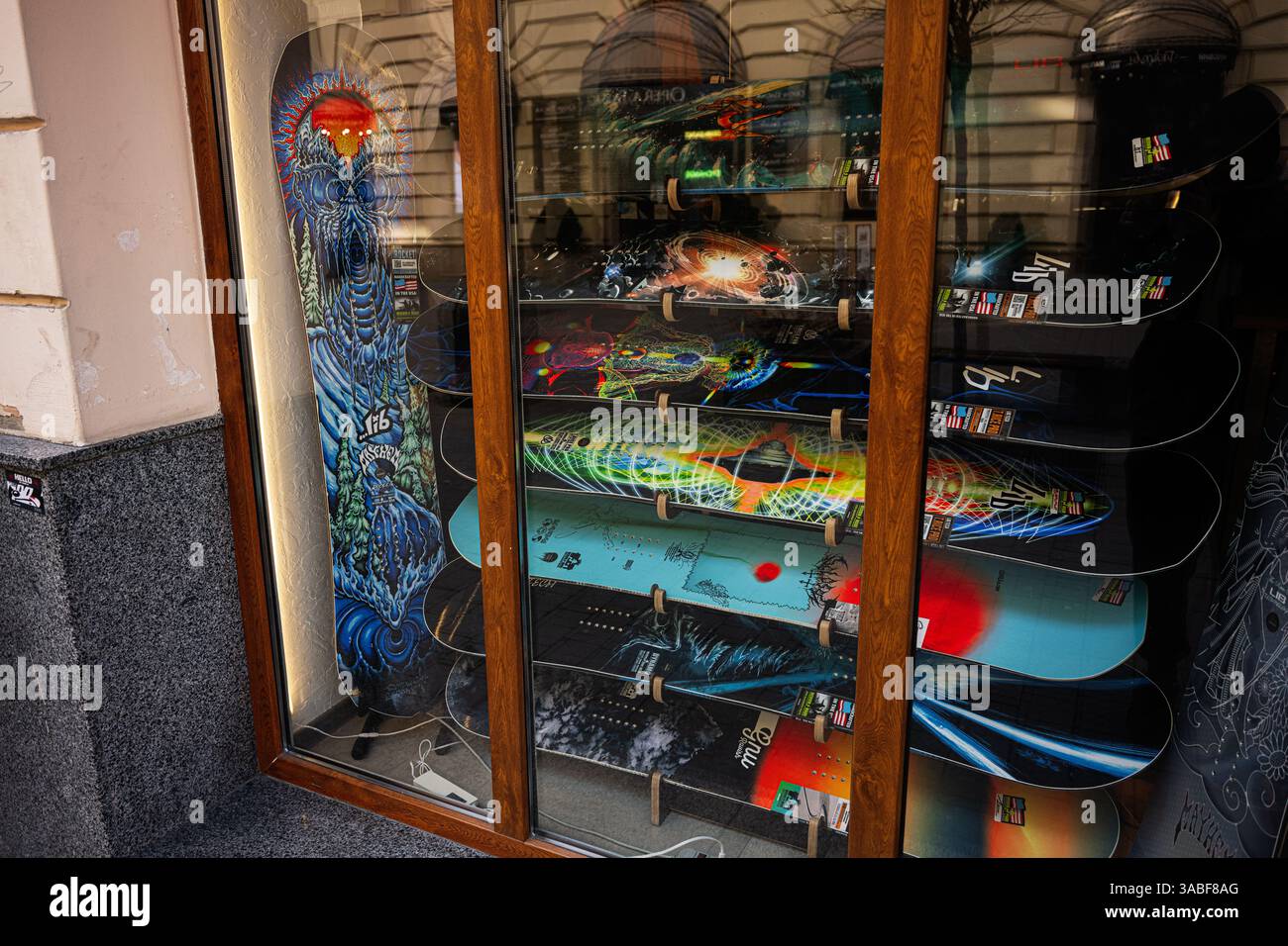 Lviv, Ukraine - April 01, 2025: Vibrant snowboard designs showcased ...