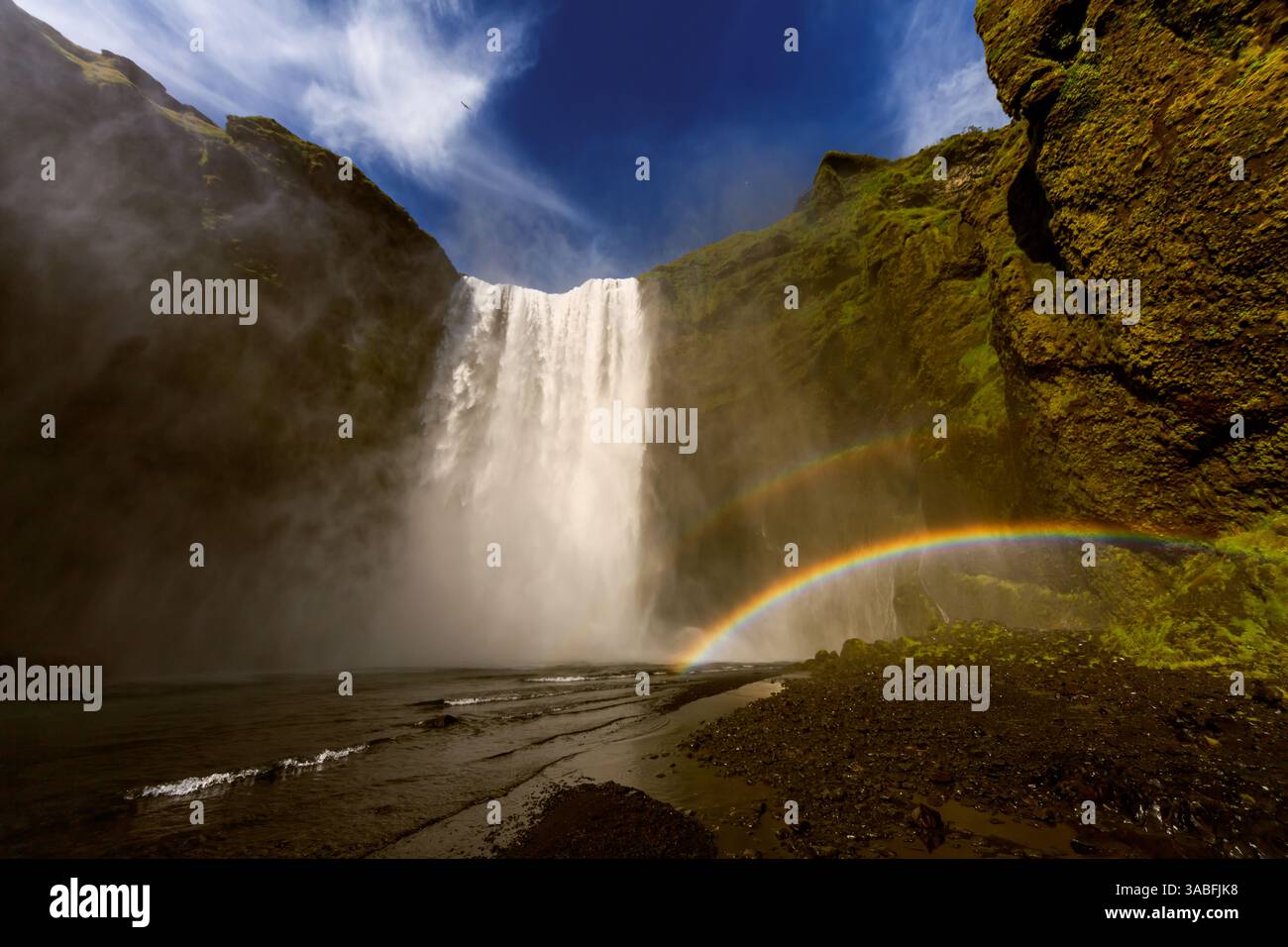 Double Rainbow over Skogafoss waterfall flowing into Skogar river ...