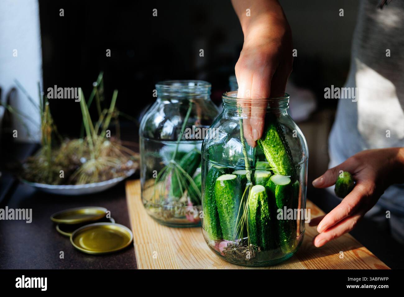 Woman putting dill jar hi-res stock photography and images - Alamy