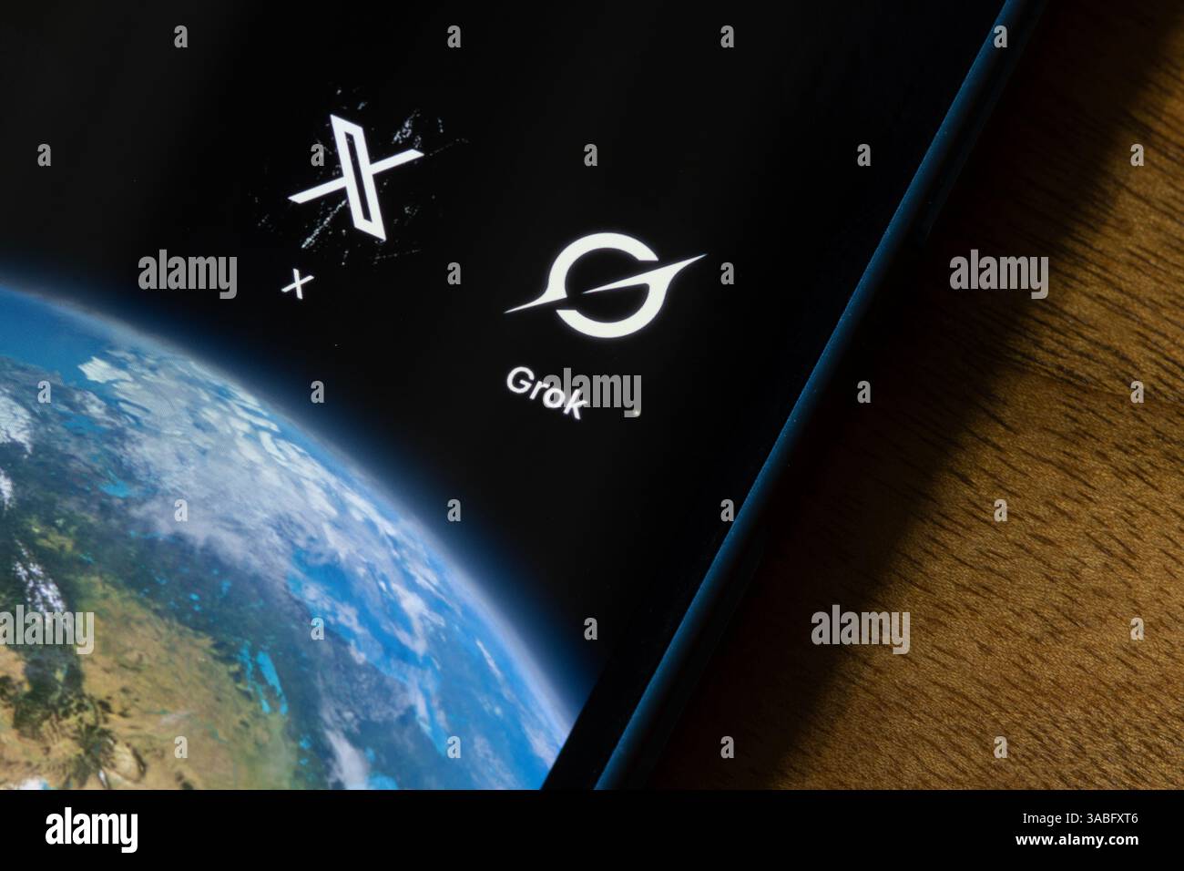 App icons of Grok, xAI's chatbot, and X are seen on the screen of an ...