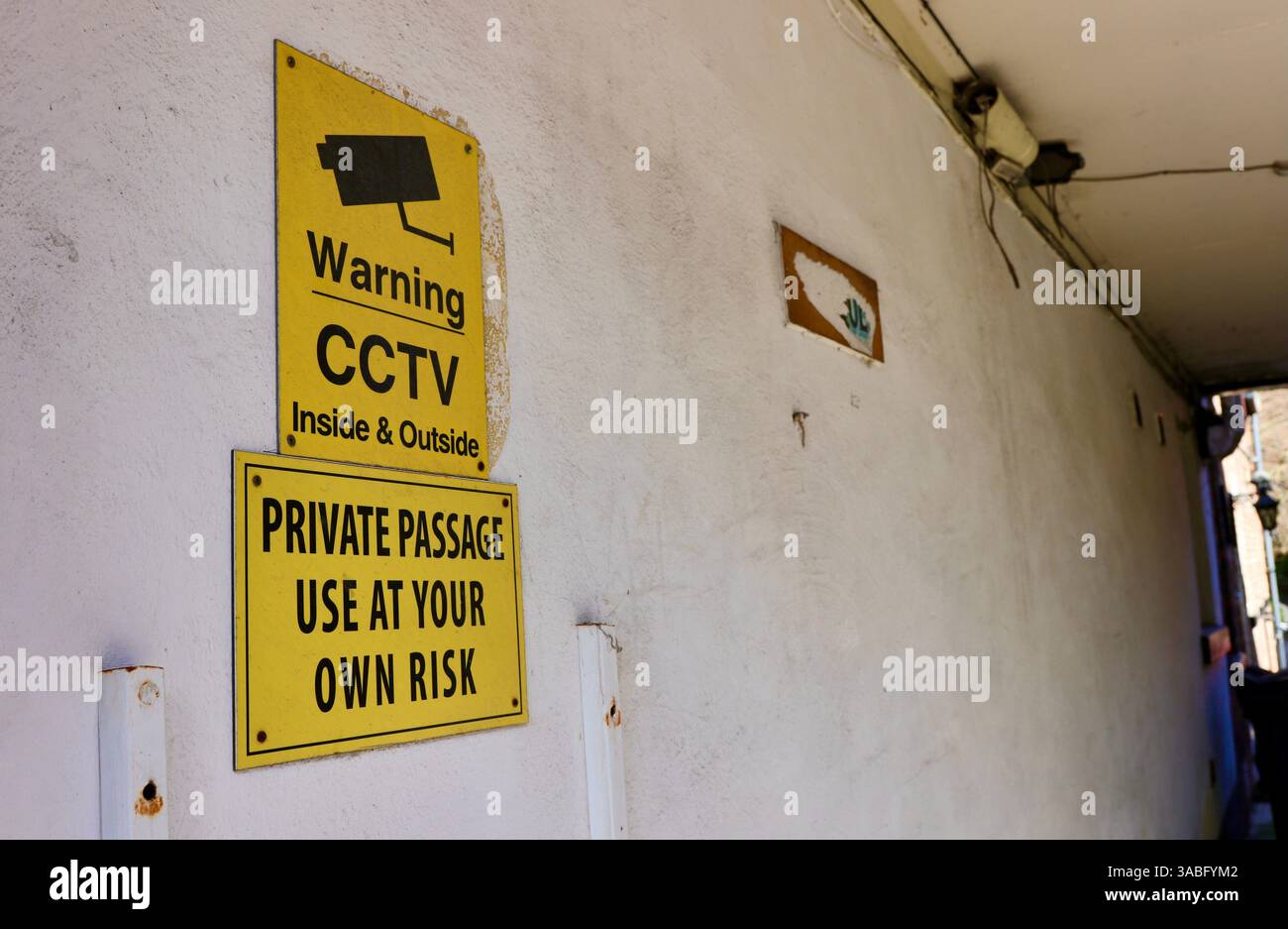 Sign on an alleyway in York, UK, reading ' Private Passage Use at Your ...