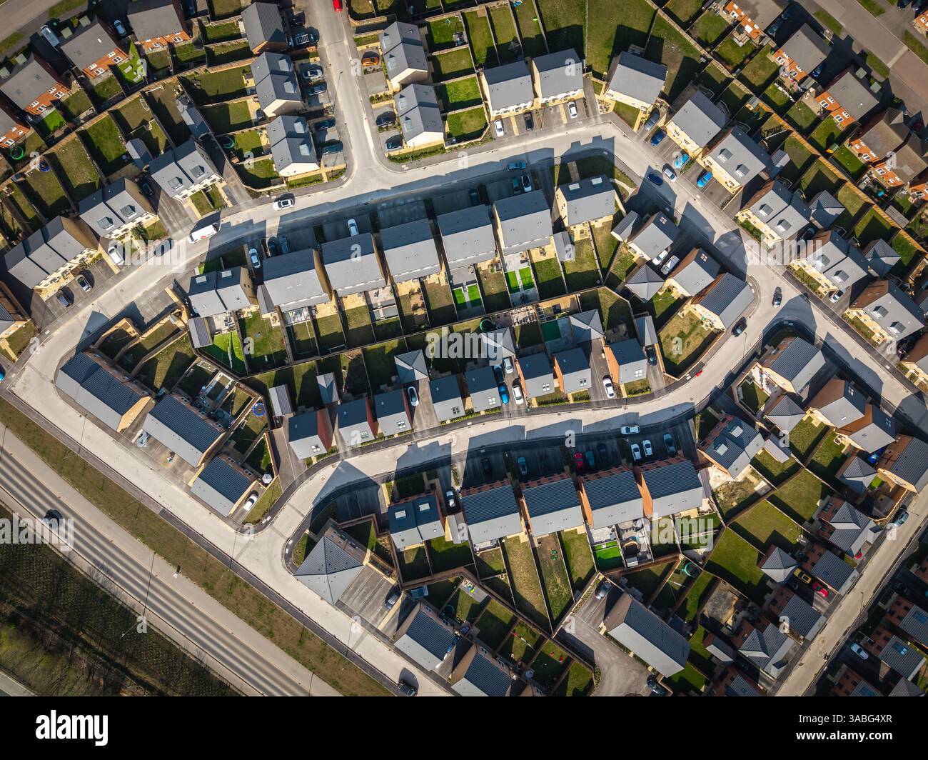 Aerial top down view above a block of newly built affordable suburban ...