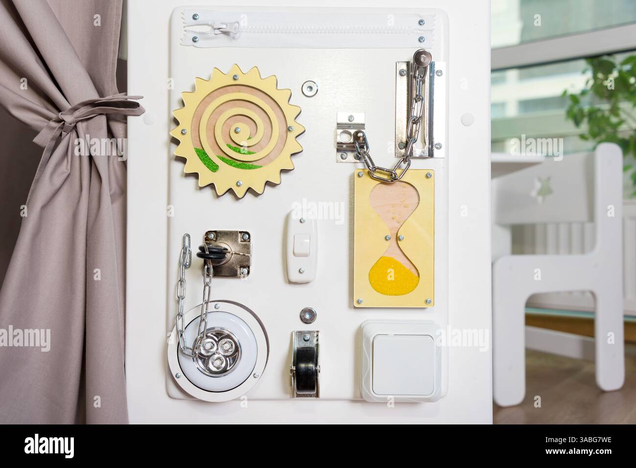 Sensory activity board with locks, switches, components designed to engage and educate children ...