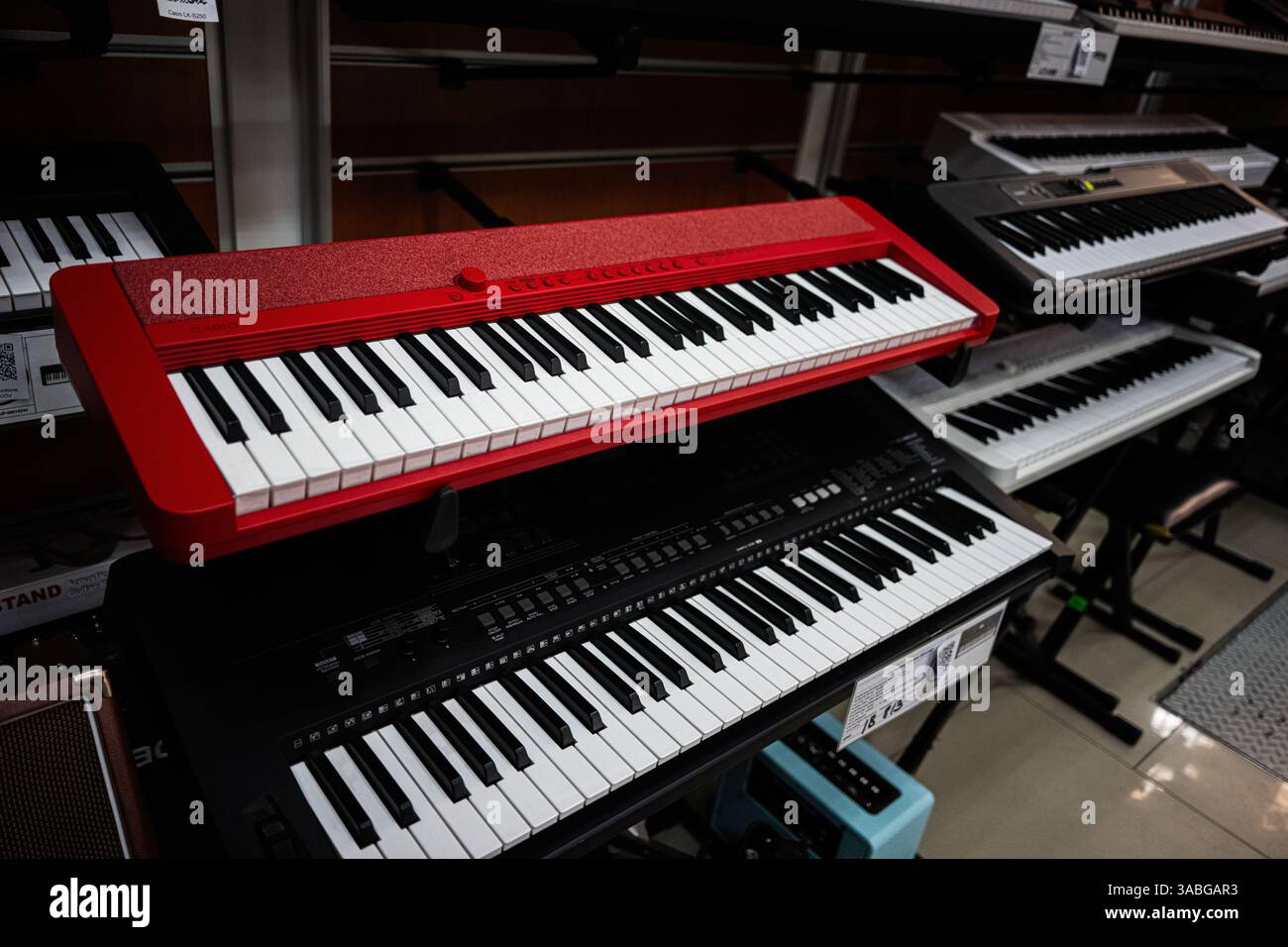 Lviv, Ukraine - April 01, 2025: Red digital Casio keyboard prominently ...