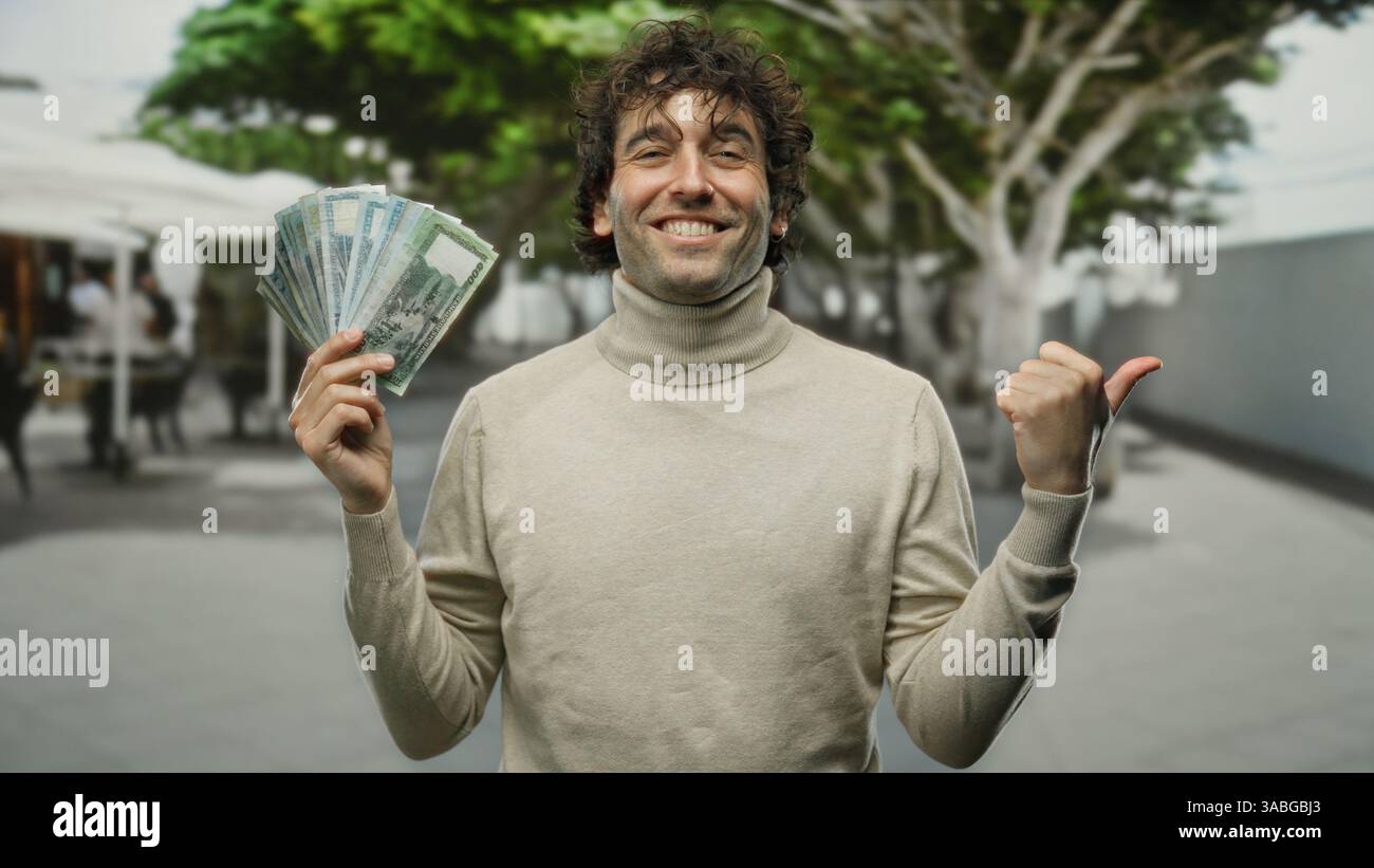 Hispanic man smiling with bangladesh taka standing outdoors on a city ...