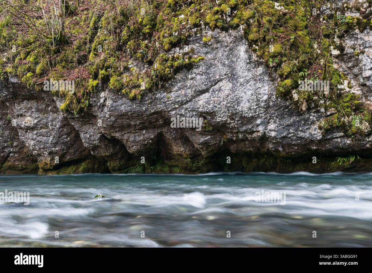 River flow under rocky cliff, detail from mountain river Dabar near ...