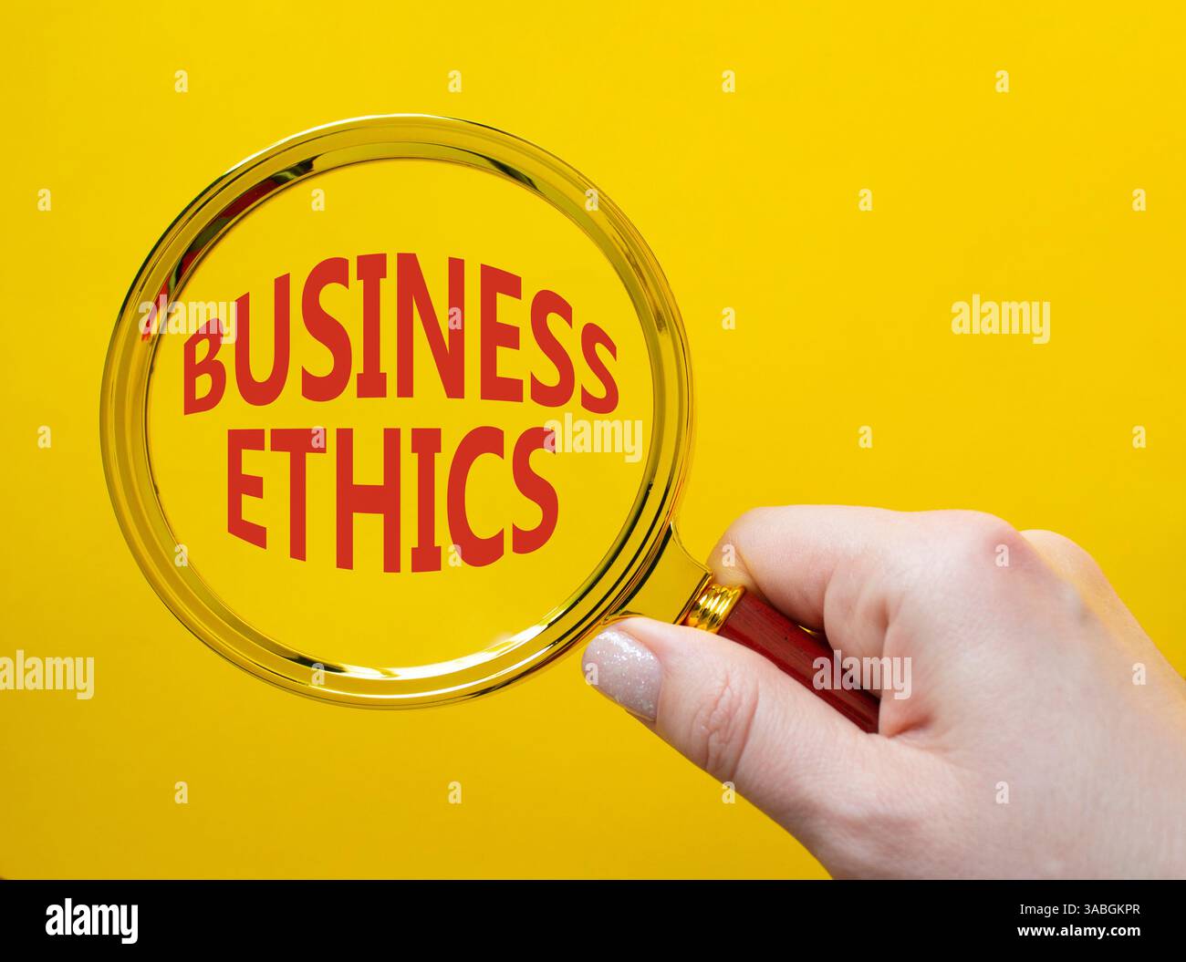 Business ethics symbol. Concept word Business ethics on magnifying ...