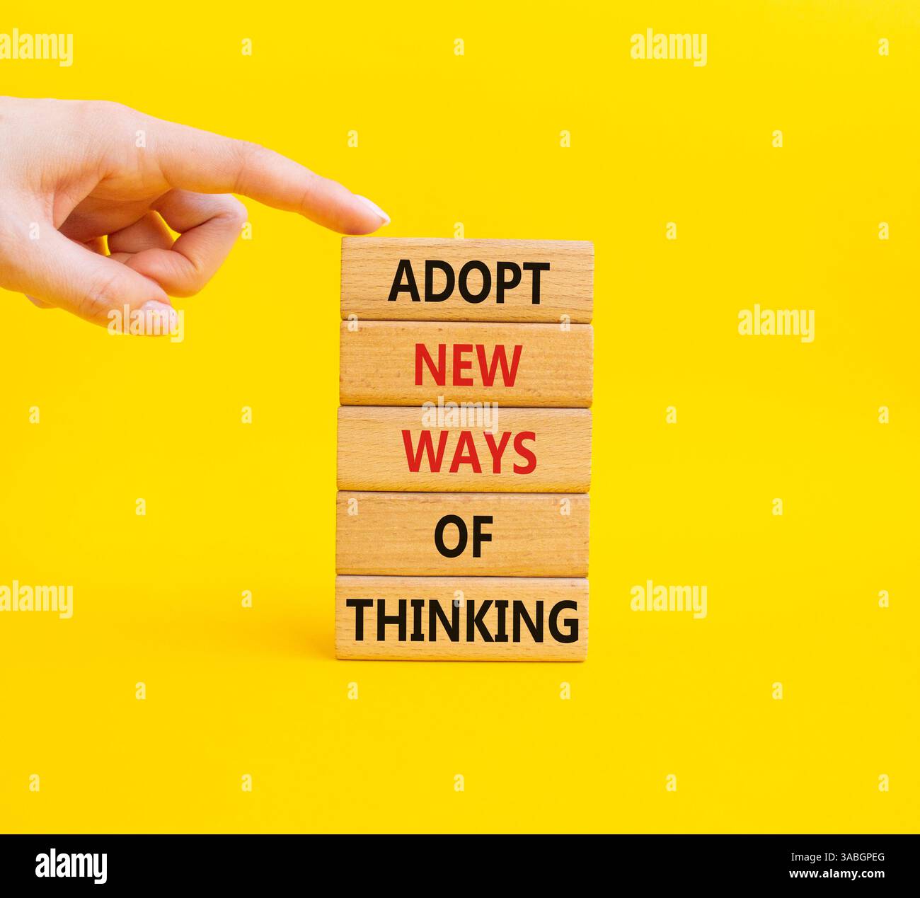 Adopt new ways of thinking symbol. Wooden blocks with words Adopt new ...