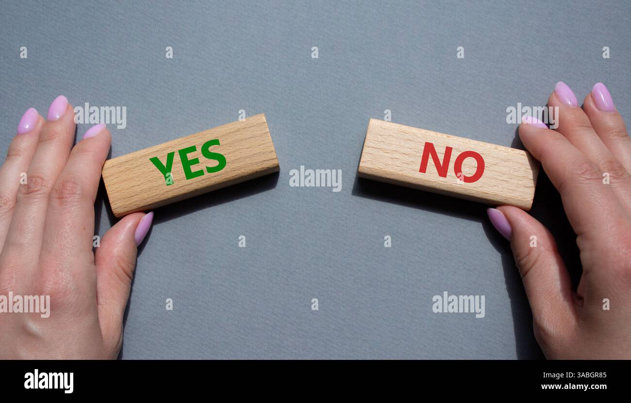 Yes or No symbol. Concept word Yes or No on wooden blocks. Businessman ...