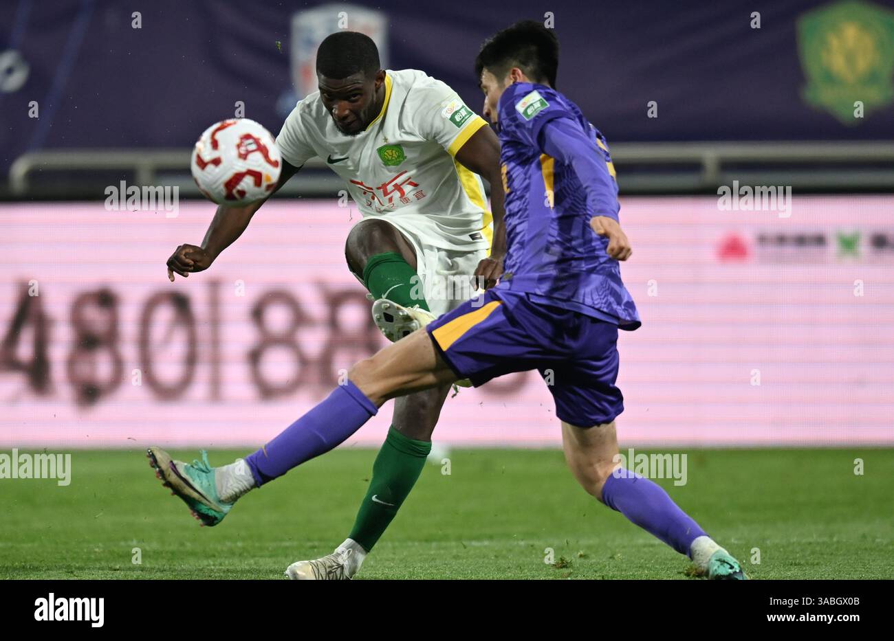 Tianjin. 2nd Apr, 2025. Fabio Abreu (L) of Beijing Guoan shoots during ...