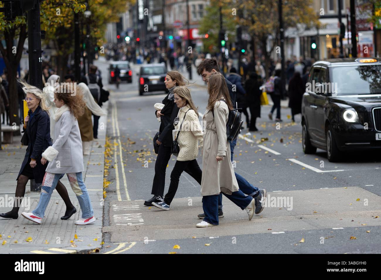 Black friday shoppers walk hi-res stock photography and images - Alamy