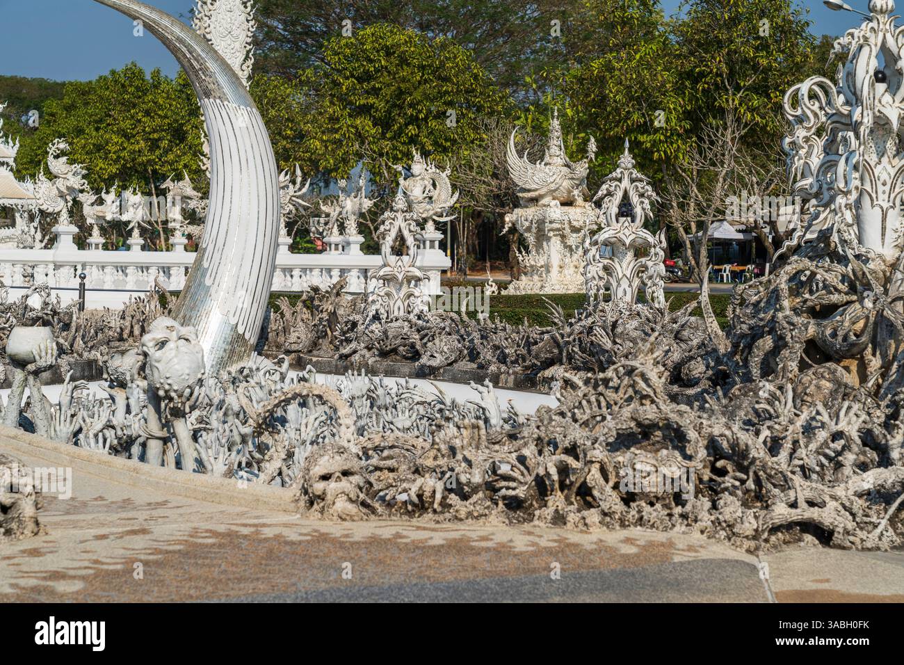 The White Temple, also known as Wat Rong Khun, is completely white and ...