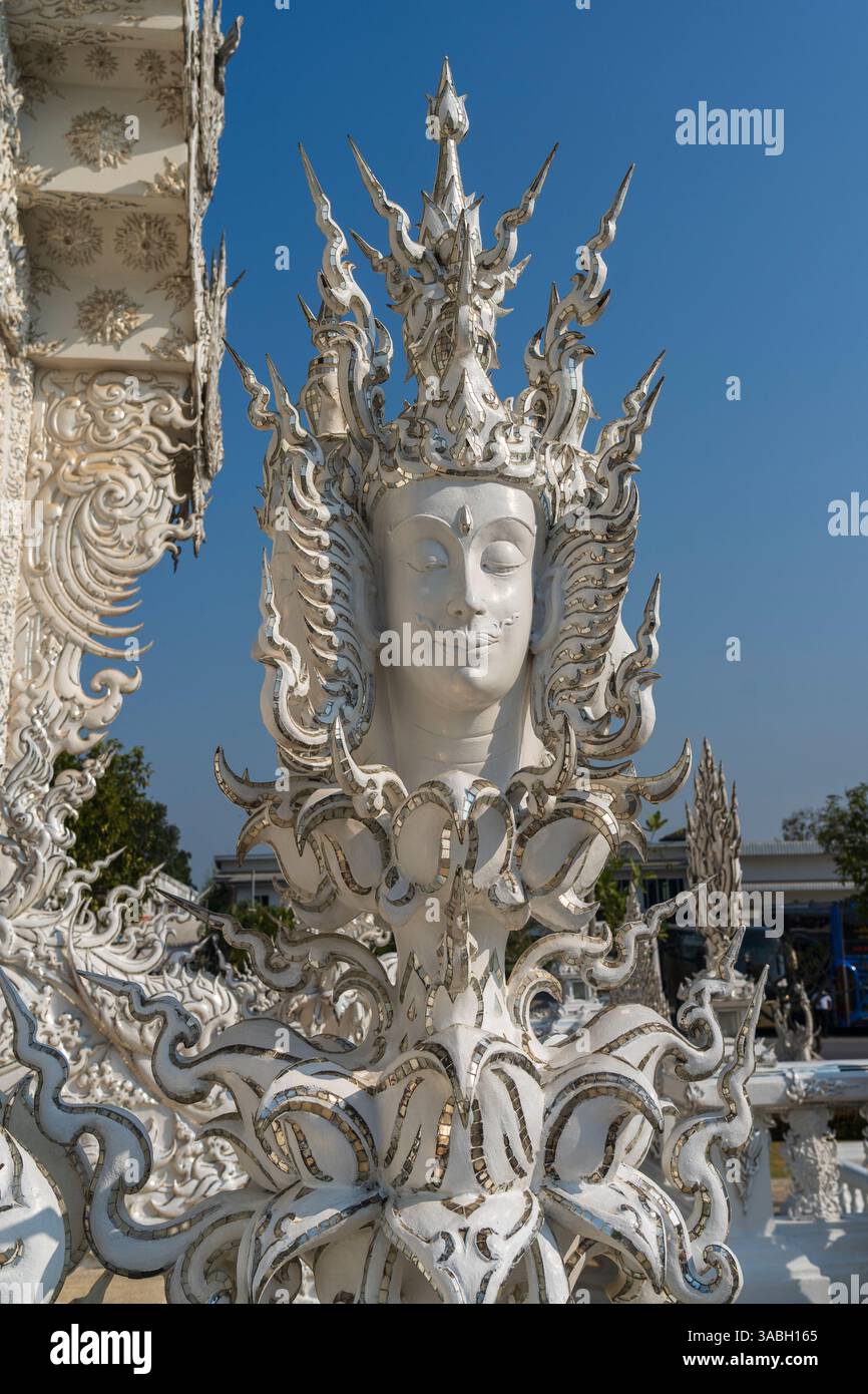 The White Temple, also known as Wat Rong Khun, is completely white and ...