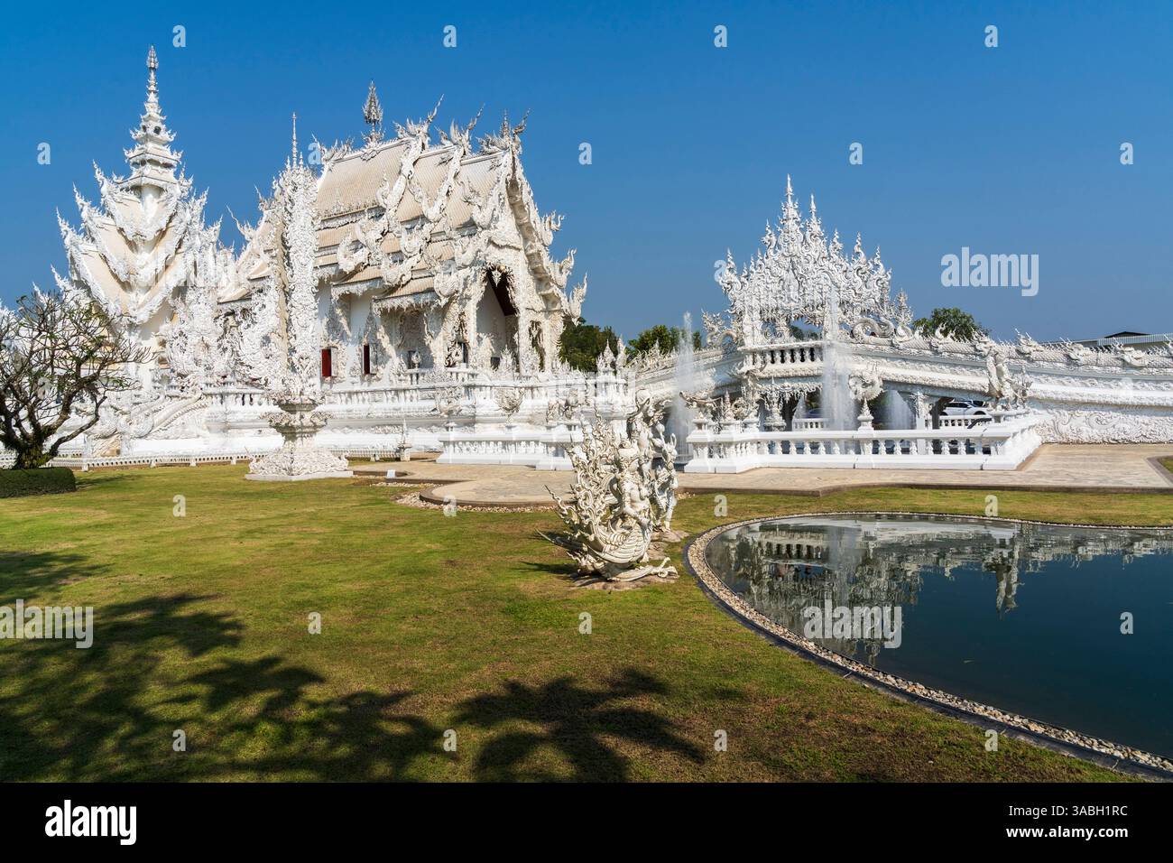 The White Temple, also known as Wat Rong Khun, is completely white and ...