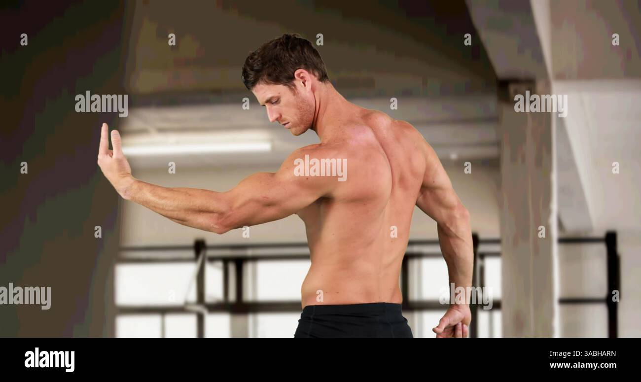 Image of strong muscular man flexing muscles over gym Stock Photo - Alamy