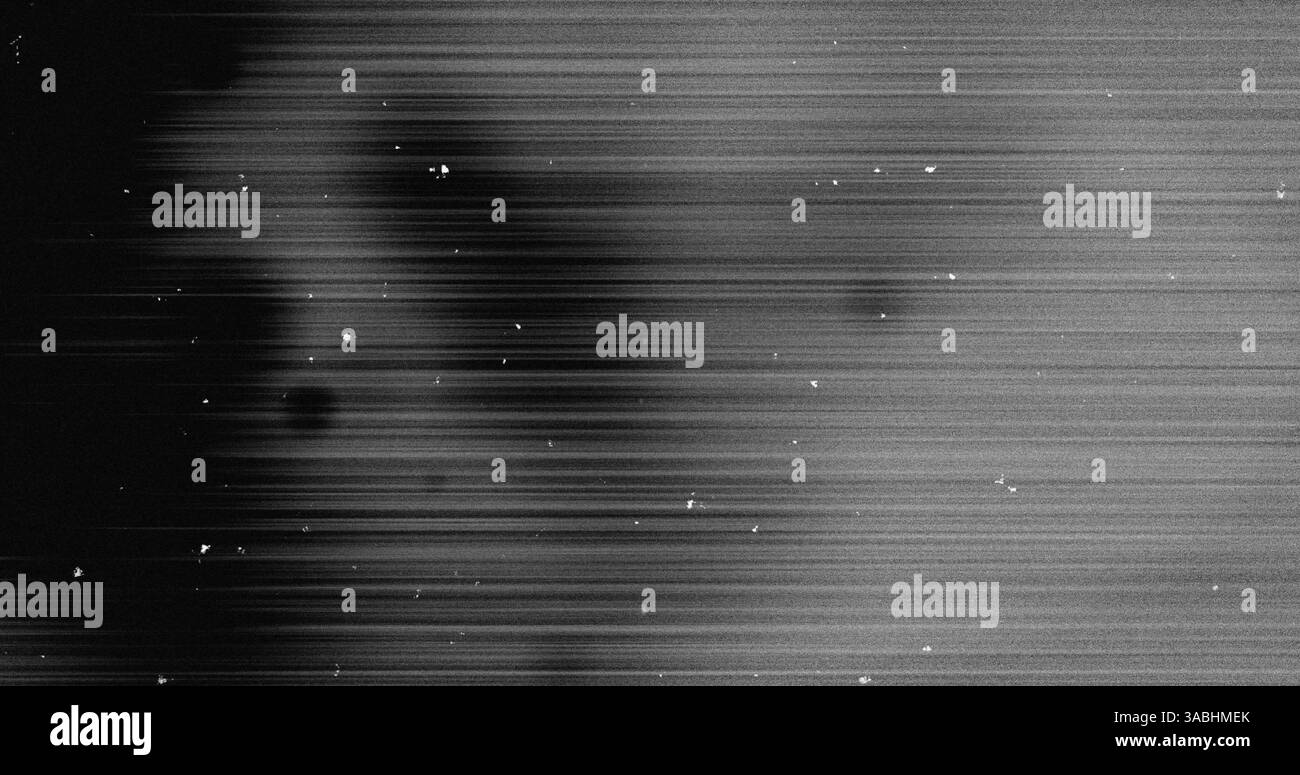 Image of dust and scratches moving over streaking black and grey lines ...
