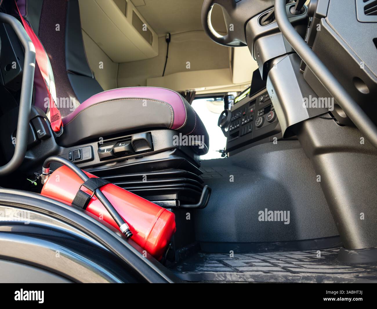 A fire extinguisher securely mounted near the driver’s seat in an HGV ...