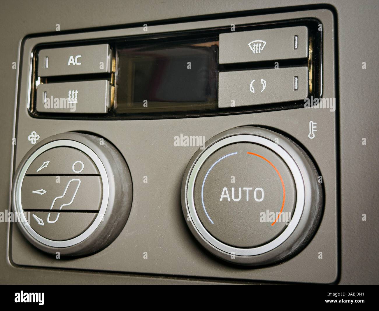 A close-up view of a lorry’s dashboard, featuring various switches ...