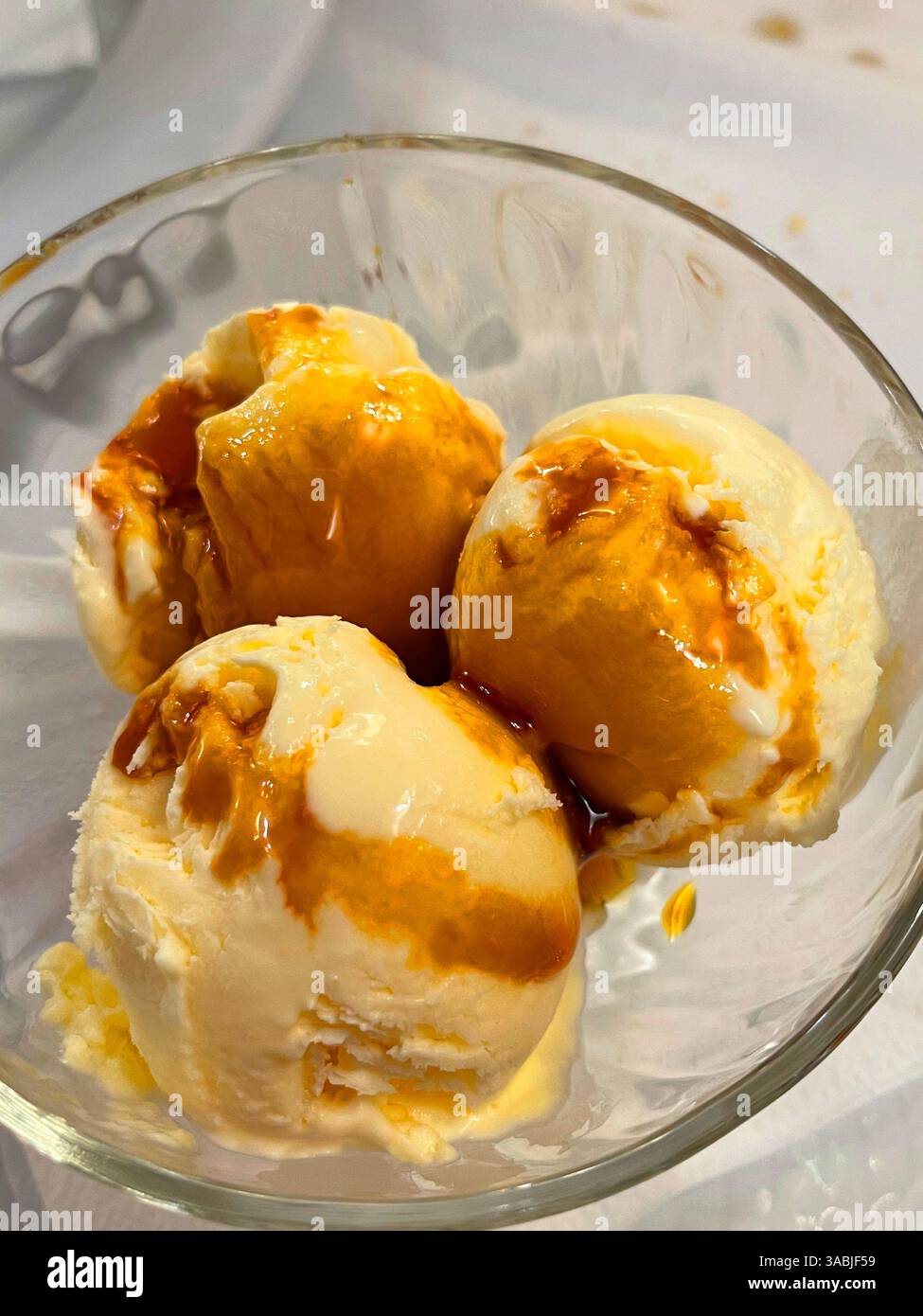 Ice cream with syrup Stock Photo - Alamy