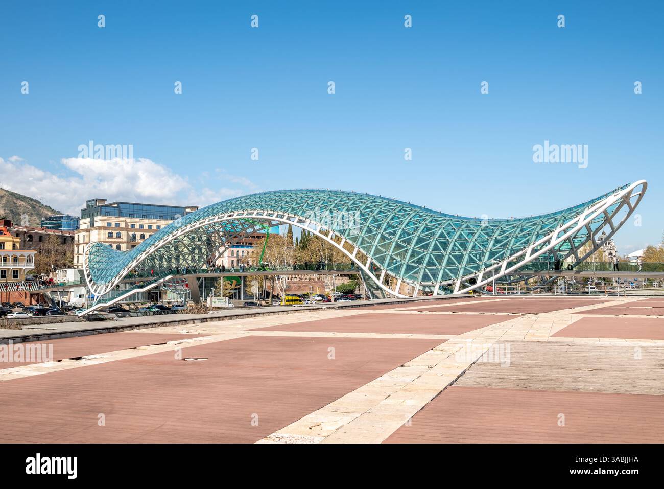Peace bridge, steel and glass construction pedestrian bridge over Kura ...