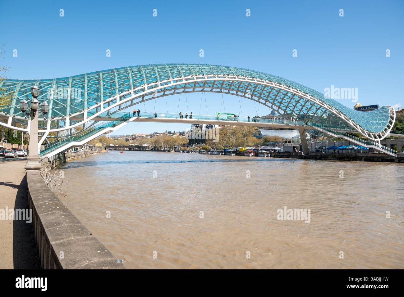 Peace bridge, steel and glass construction pedestrian bridge over Kura ...