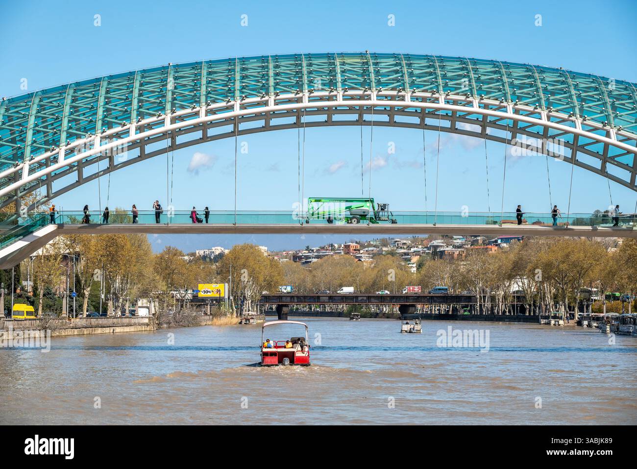 Peace bridge, steel and glass construction pedestrian bridge over Kura ...