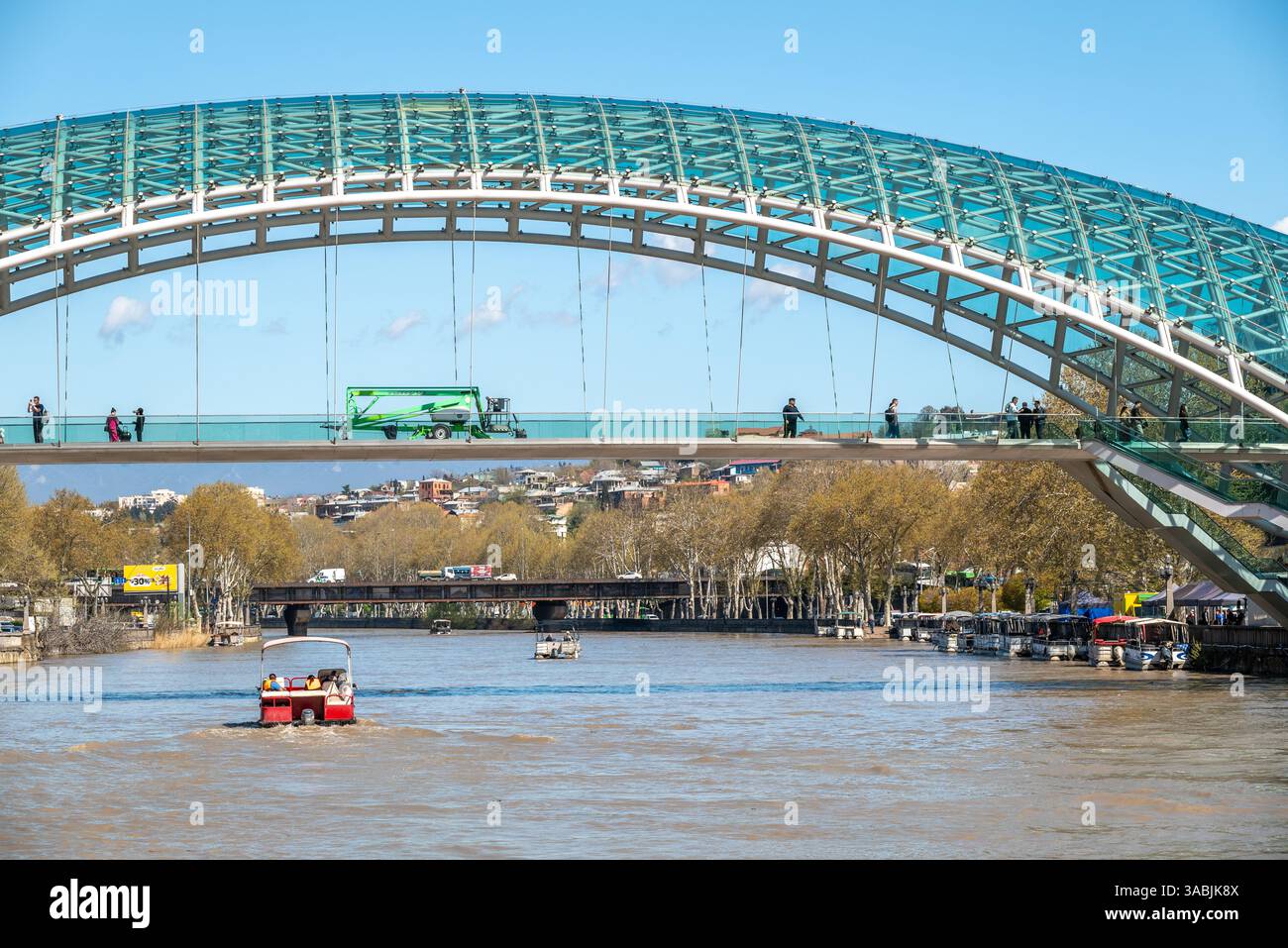 Peace bridge, steel and glass construction pedestrian bridge over Kura ...