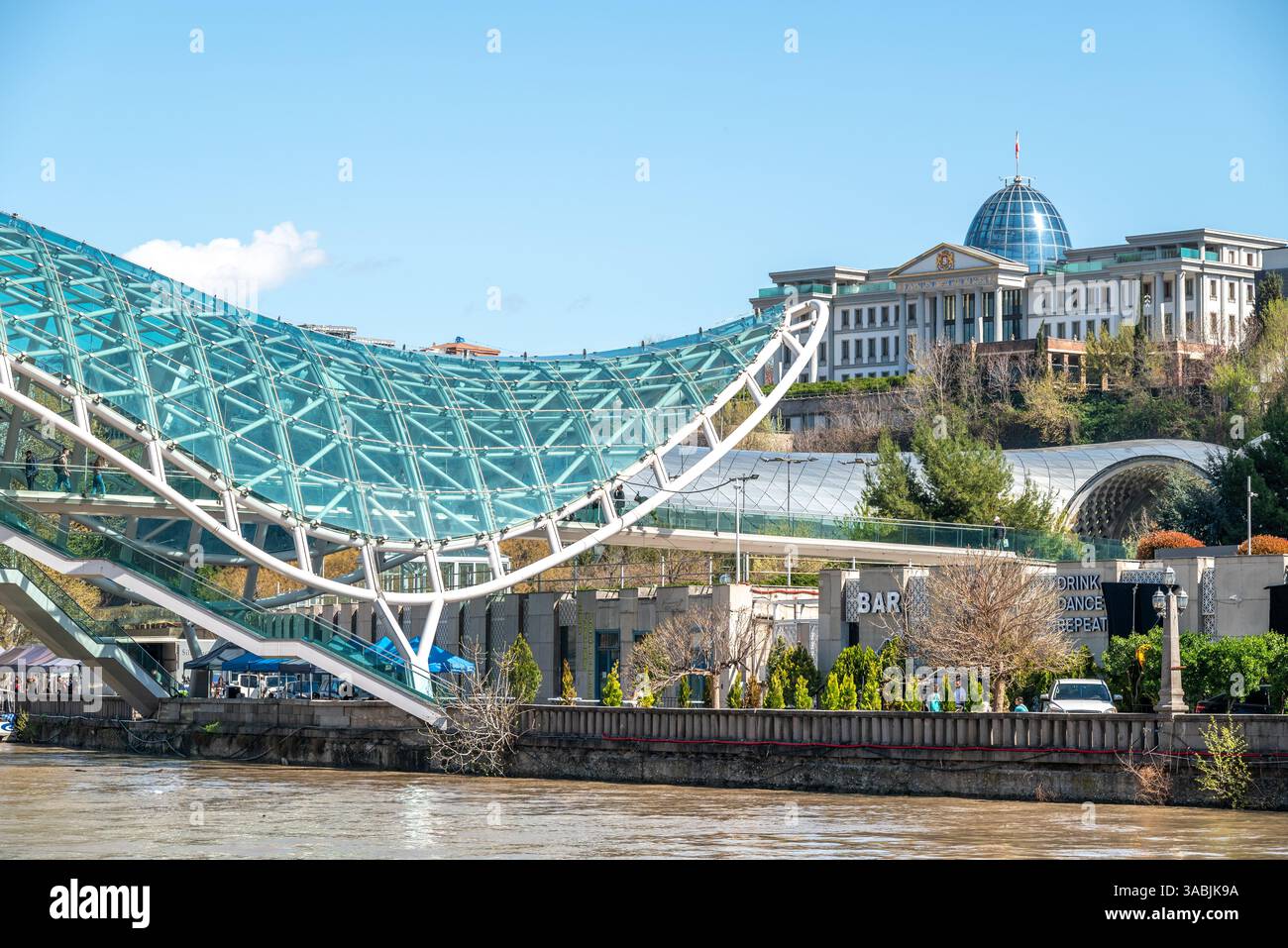 Peace bridge, steel and glass construction pedestrian bridge over Kura ...
