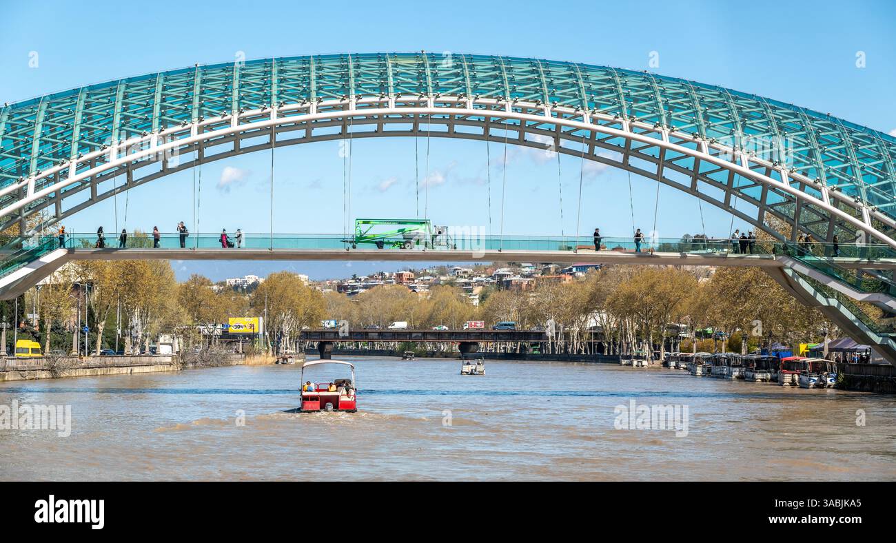Peace bridge, steel and glass construction pedestrian bridge over Kura ...