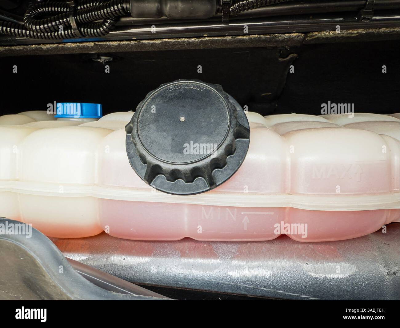 Close-up view of a coolant reservoir under the hood of an HGV (lorry ...