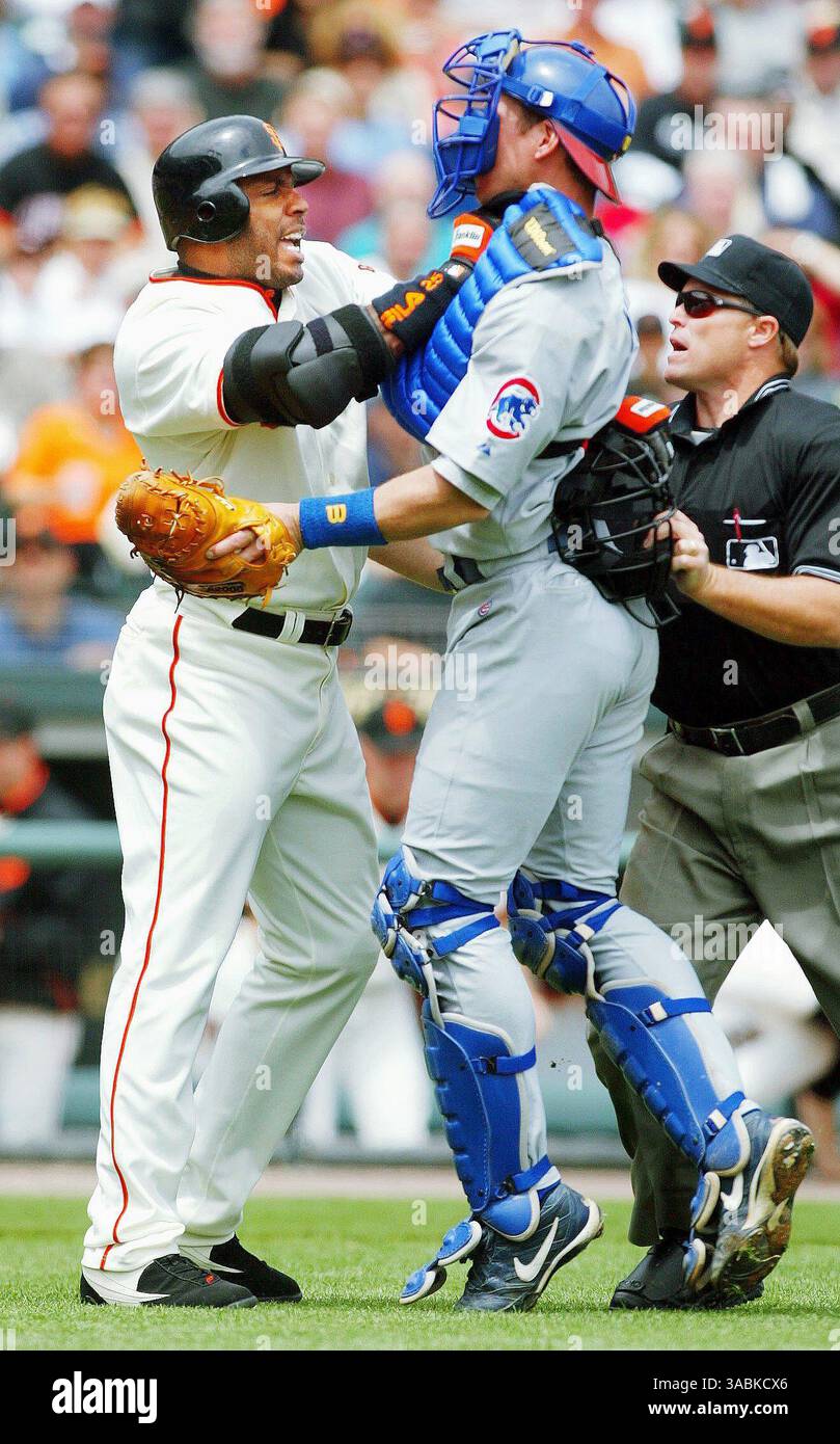 Nick Lammers/staff 5/1/03 Tribune Sports Barry Bonds grabs the throat of Cubs catcher Damian ...