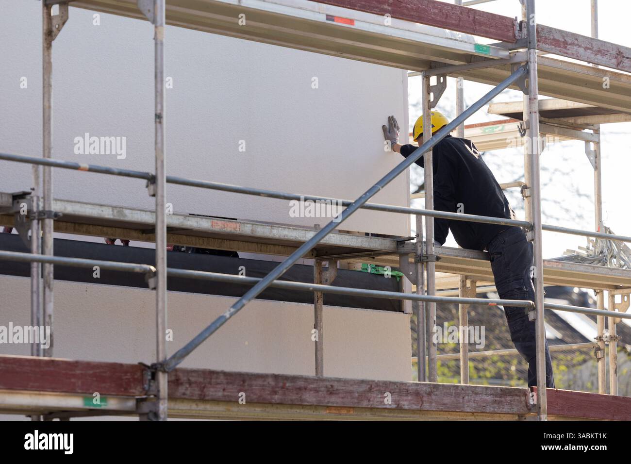 Cologne, Germany. 02nd Apr, 2025. A wall with windows for a ...