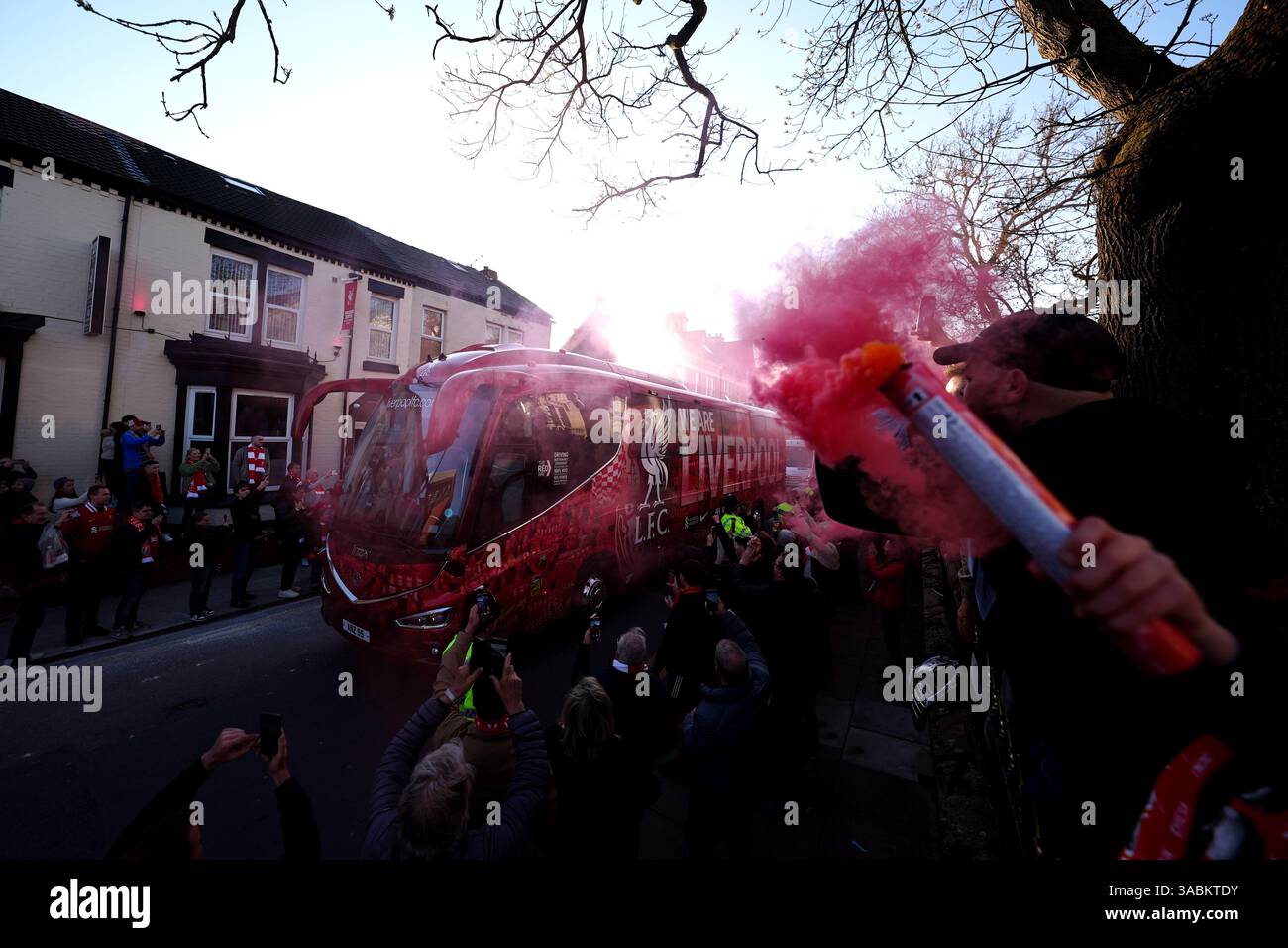 Liverpool fans set of flares as the Liverpool team coach arrives ahead ...