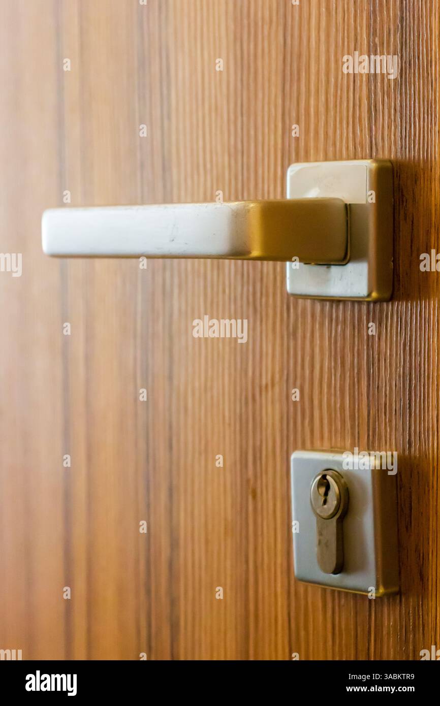 Closeup of Modern Door Handle and Lock on Wooden Door Stock Photo - Alamy