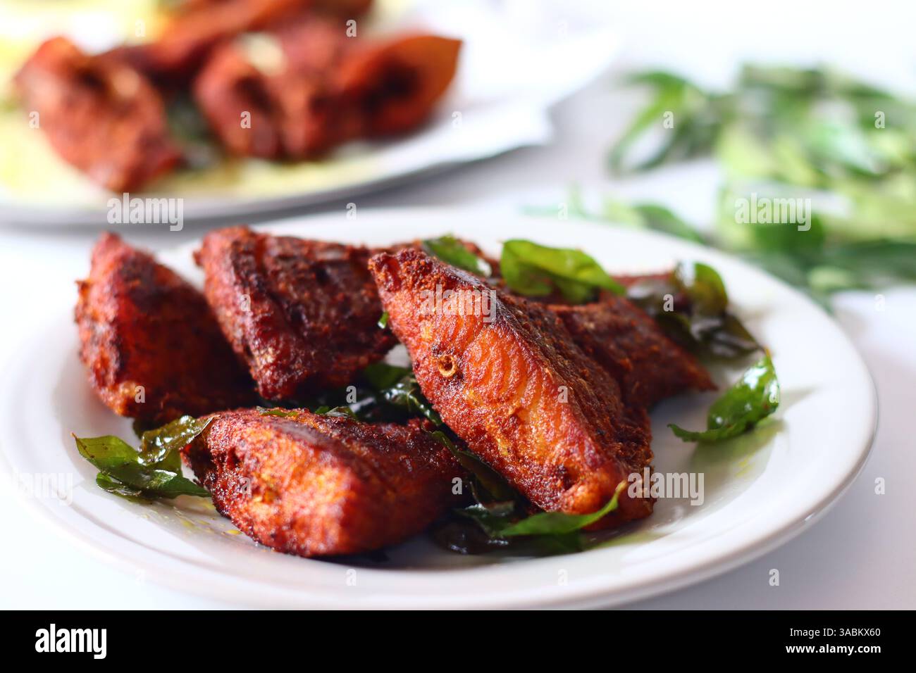 Vietnam pearl spot fish marinated with aromatic spices and fried to ...