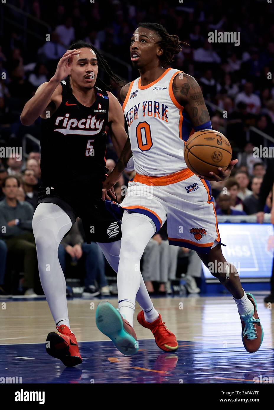 New York Knicks guard Delon Wright (0) drives past Portland Trail ...