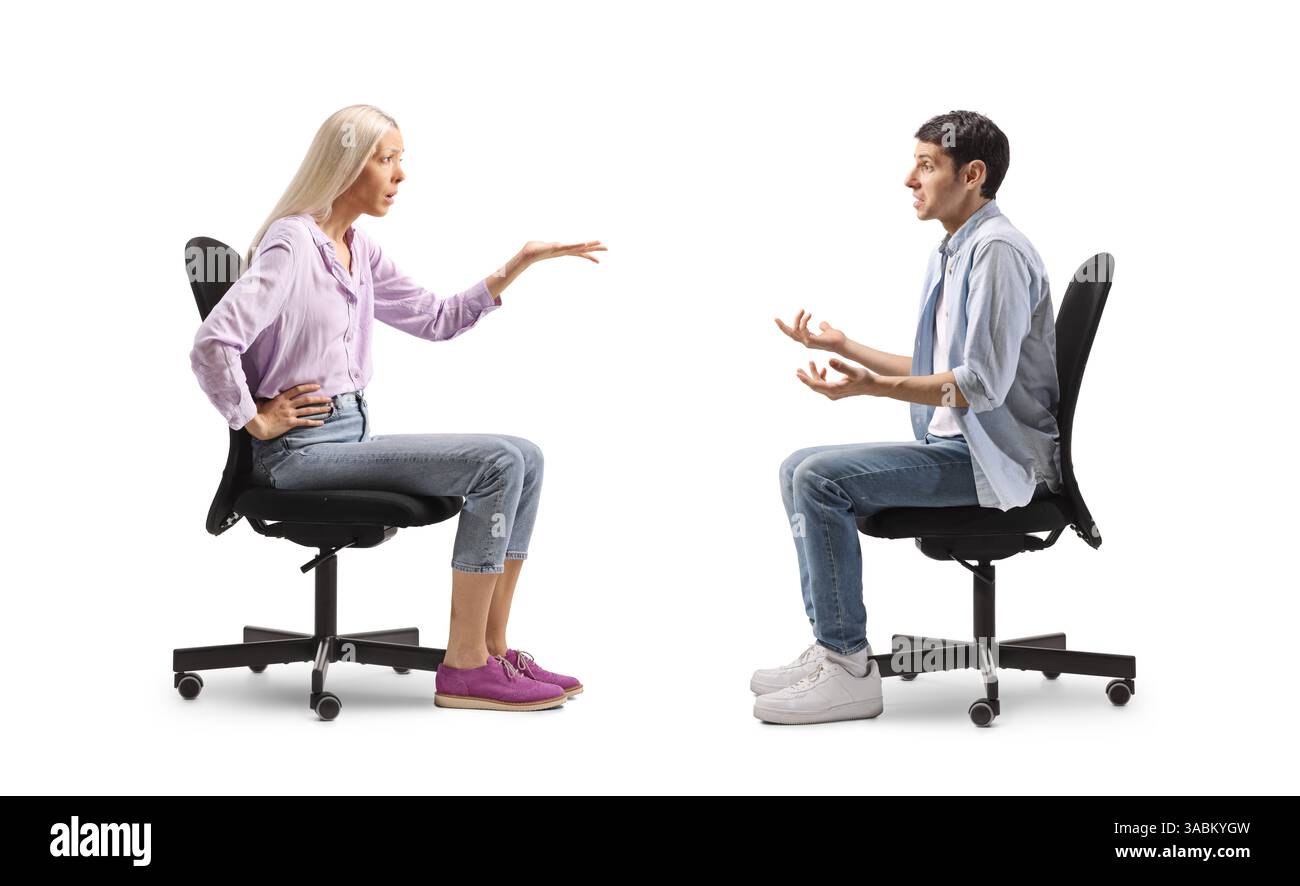 Angry woman sitting in an office chair and talking to a man isolated on ...
