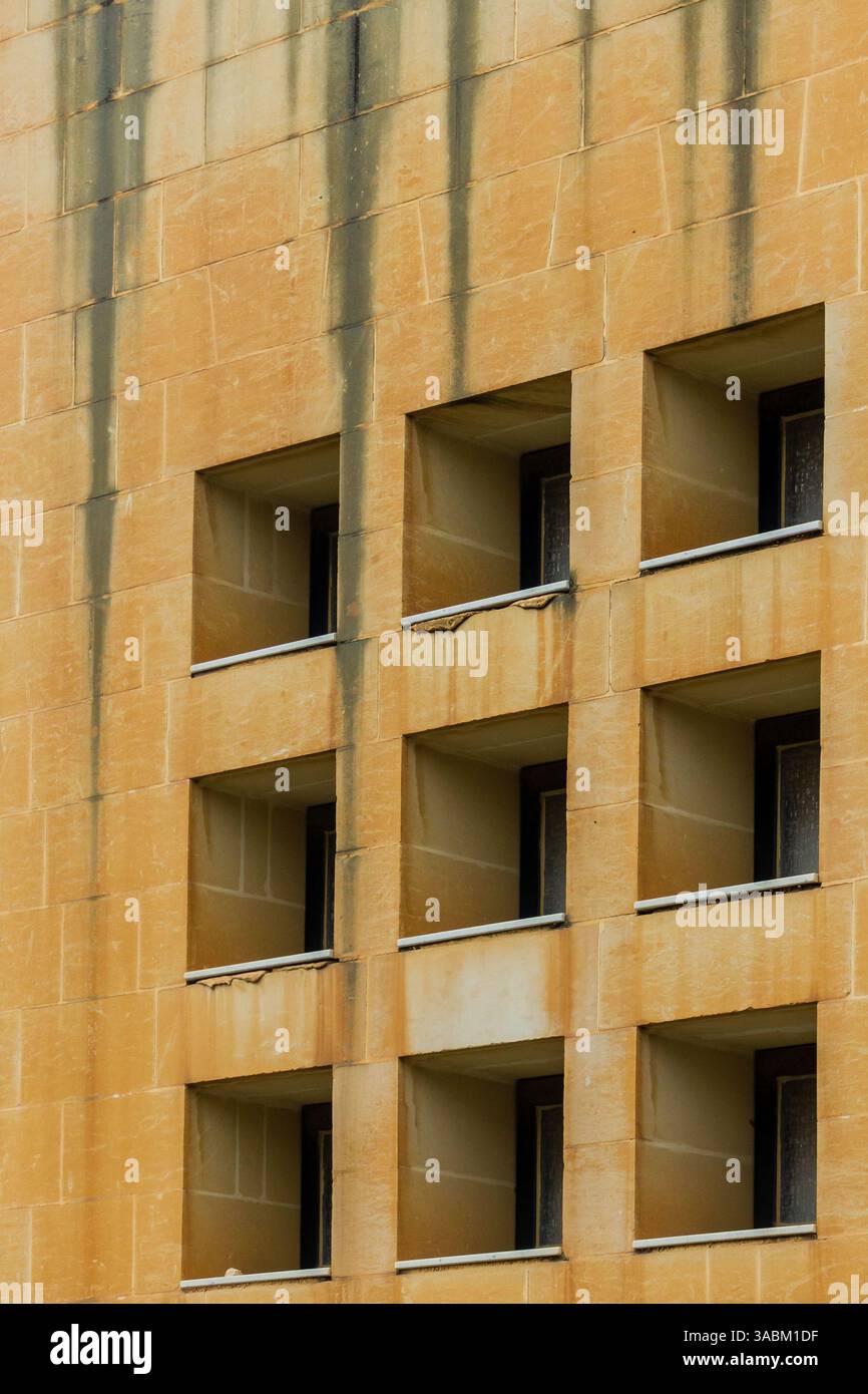 Close-Up of Building Facade With Repetitive Windows and Weathered Walls ...