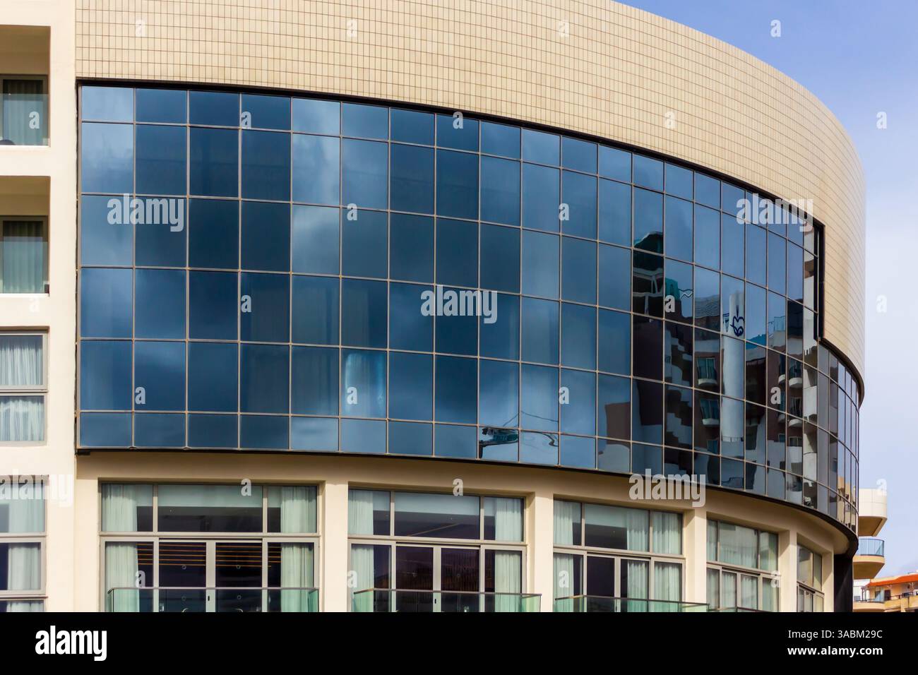 Modern Curved Building Facade With Glass Pane Windows Stock Photo - Alamy