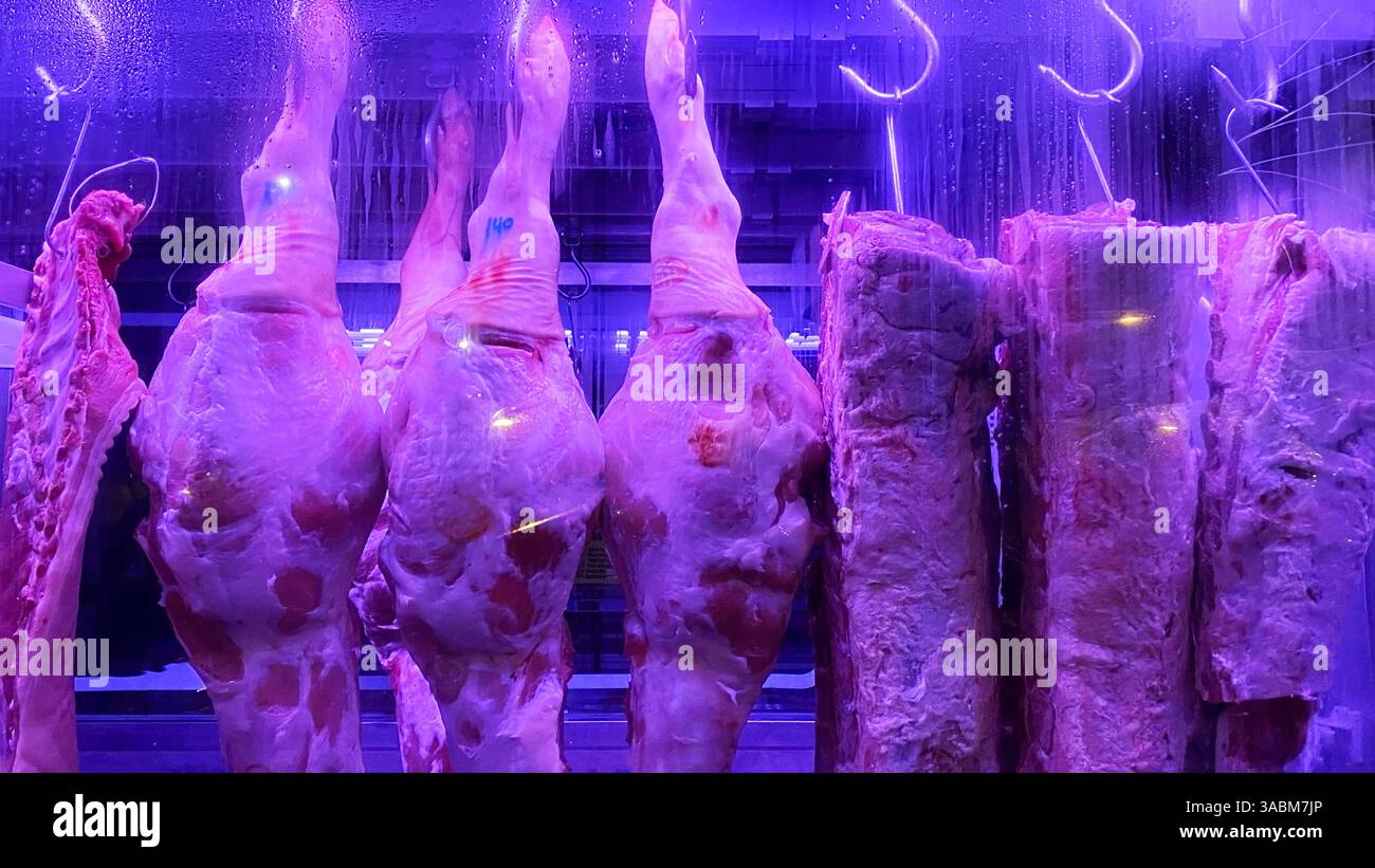 Hanging fresh meat in a butcher shop, closeup photo Stock Photo - Alamy