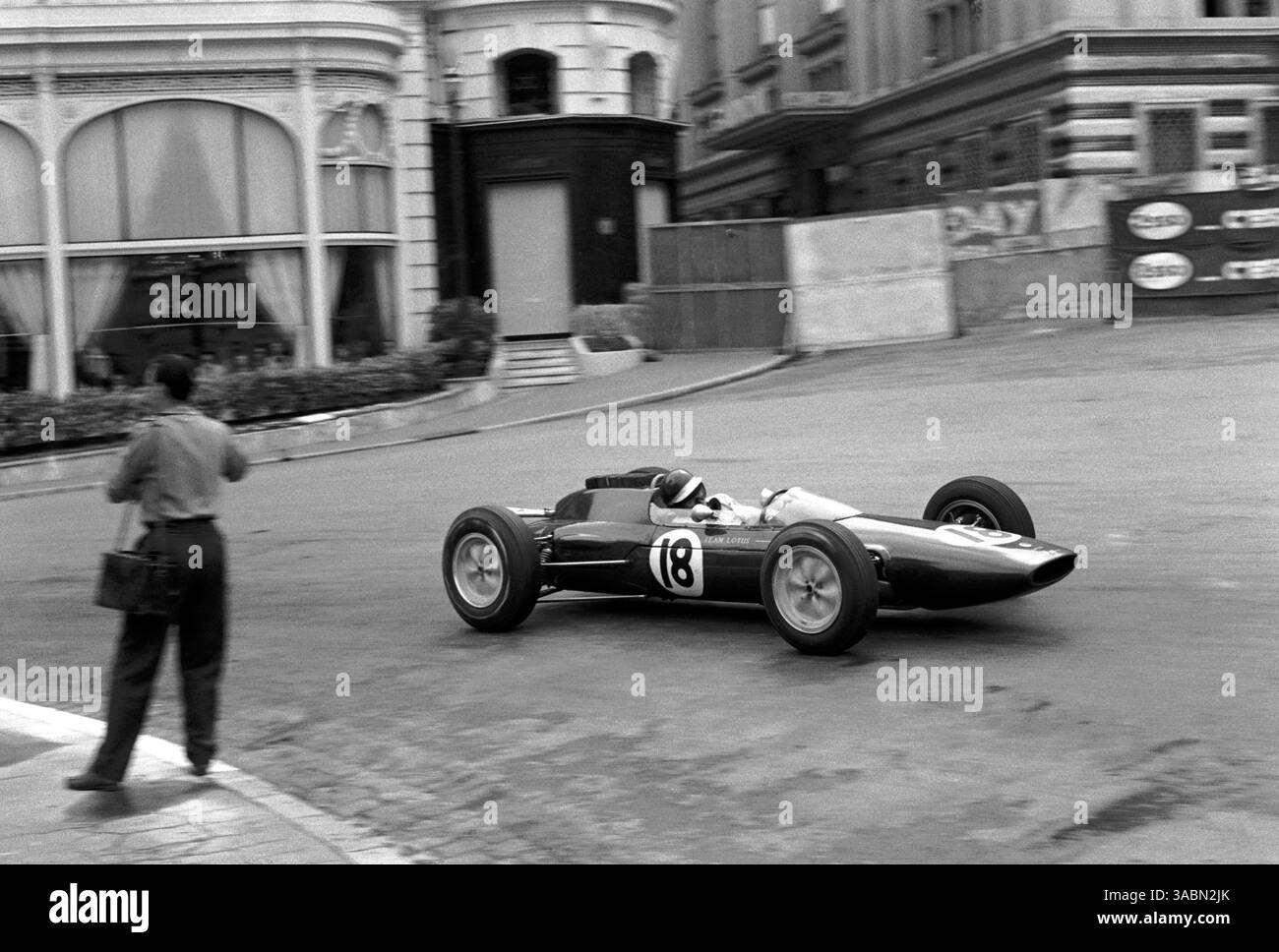 Pole sitter Jim Clark (GBR) Lotus 25, who retired on lap fifty-five with a broken clutch, has an ...