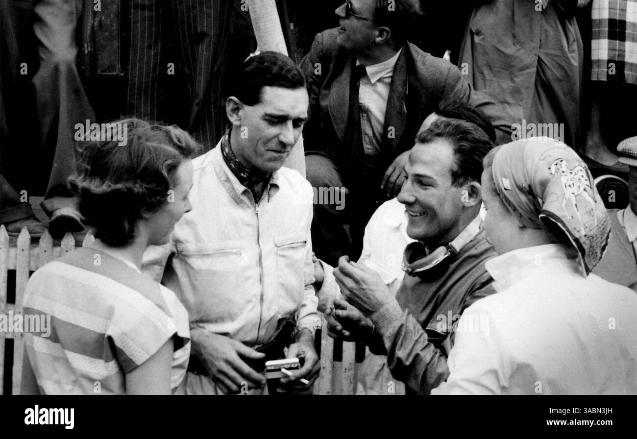 Peter Walker (GBR) and Stirling Moss (GBR) Jaguar C-Type, talking ...