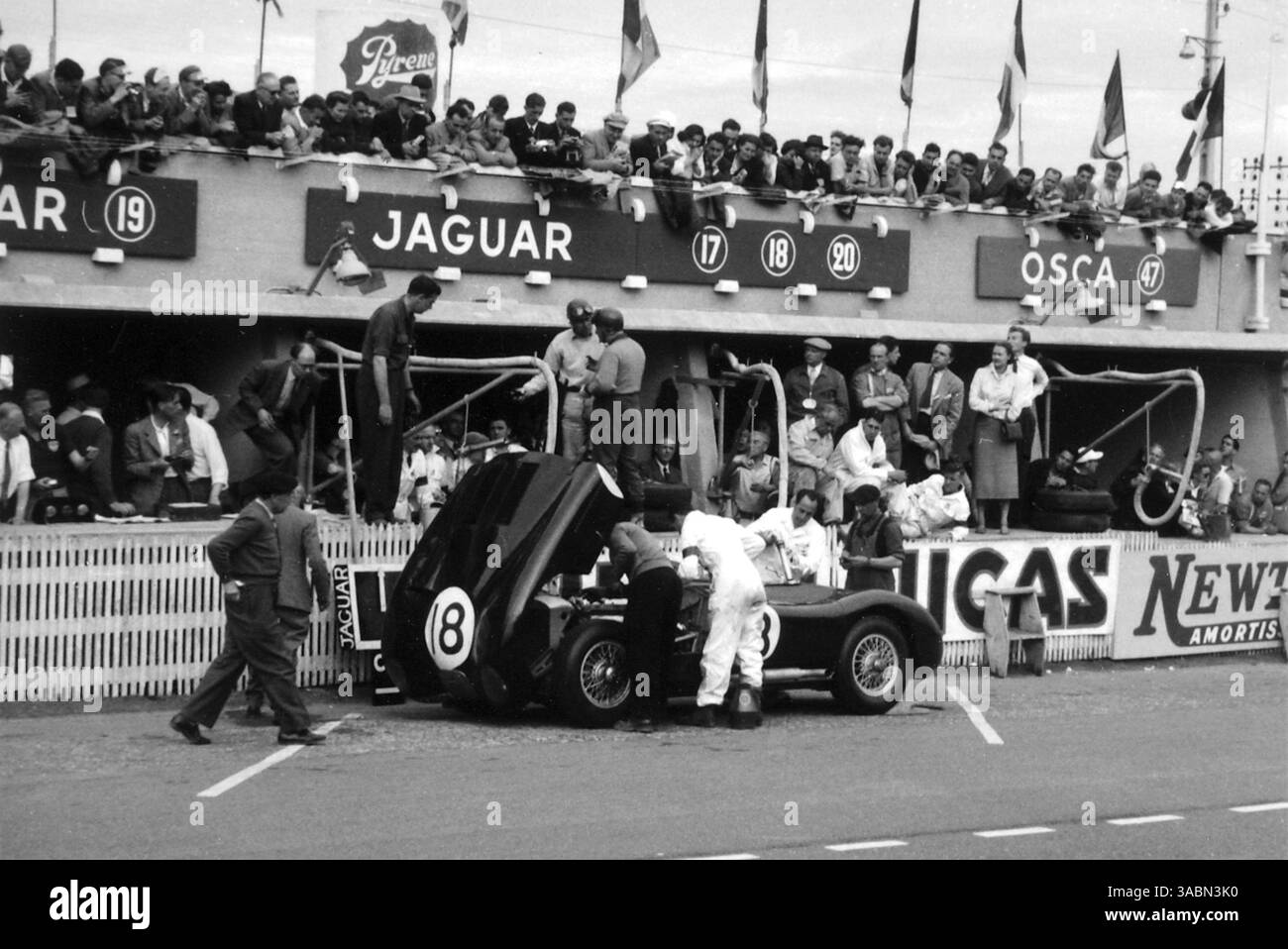 Winners, Tony Rolt (GBR) and Duncan Hamilton (GBR) on the pit counter ...