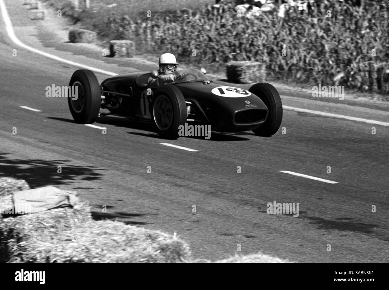 Pole sitter John Surtees (GBR) Lotus Climax 18 retired on lap 36 when ...