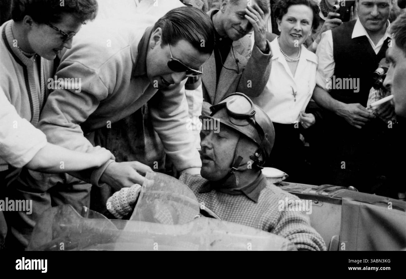 Winners, Tony Rolt (GBR) rushes to greet Duncan Hamilton (GBR) as he ...