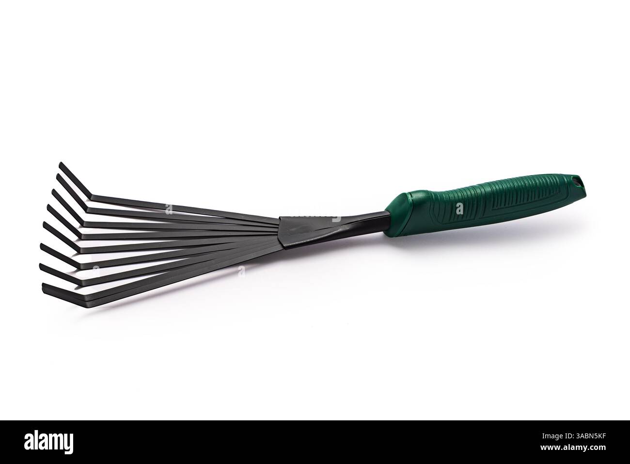 Small garden rake isolated on white background. Gardening tools Stock ...