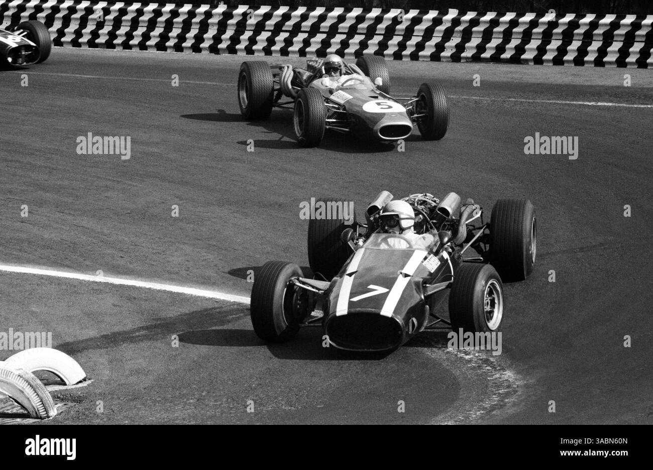Race winner John Surtees (GBR) Cooper T81 leads second placed finisher ...