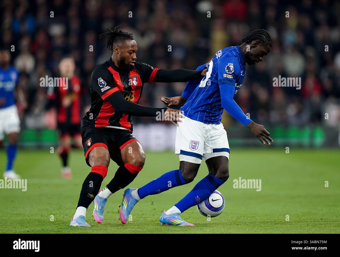 Bournemouth's Antoine Semenyo (left) and Ipswich Town's Axel Tuanzebe ...